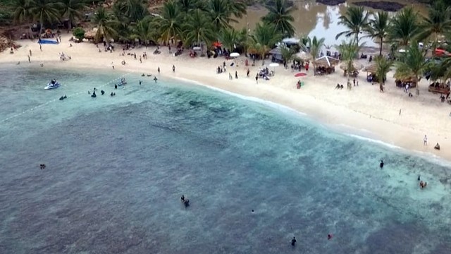 Wisata Pantai Terbaru di Boltim, Tanjung Cemara Desa Iyok | kumparan.com